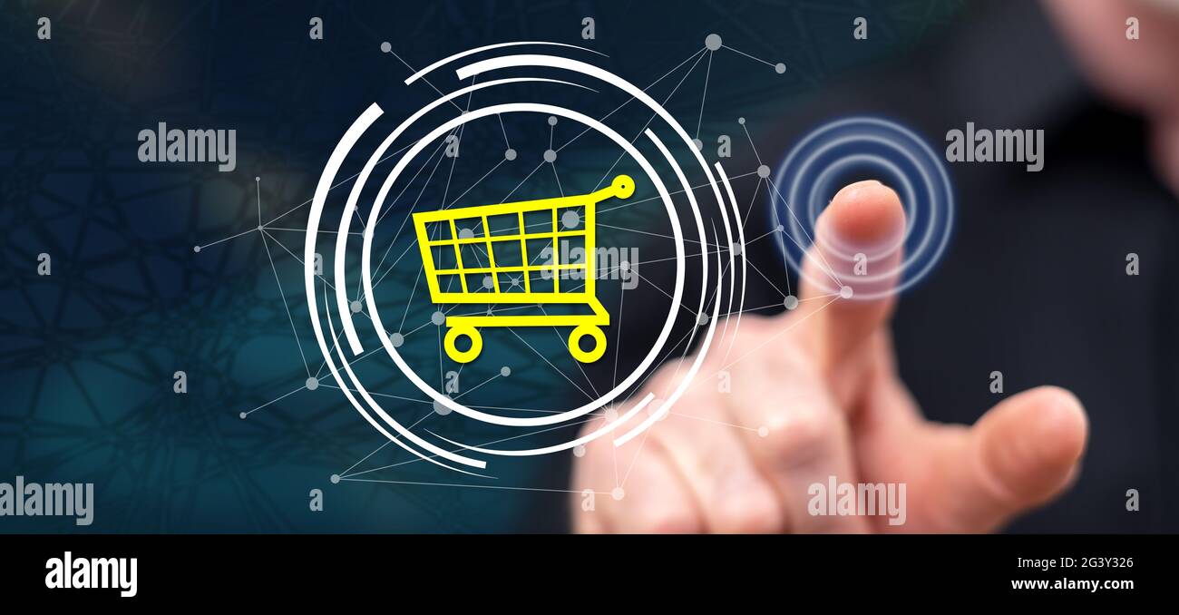 Man touching an online shopping concept on a touch screen with his ...