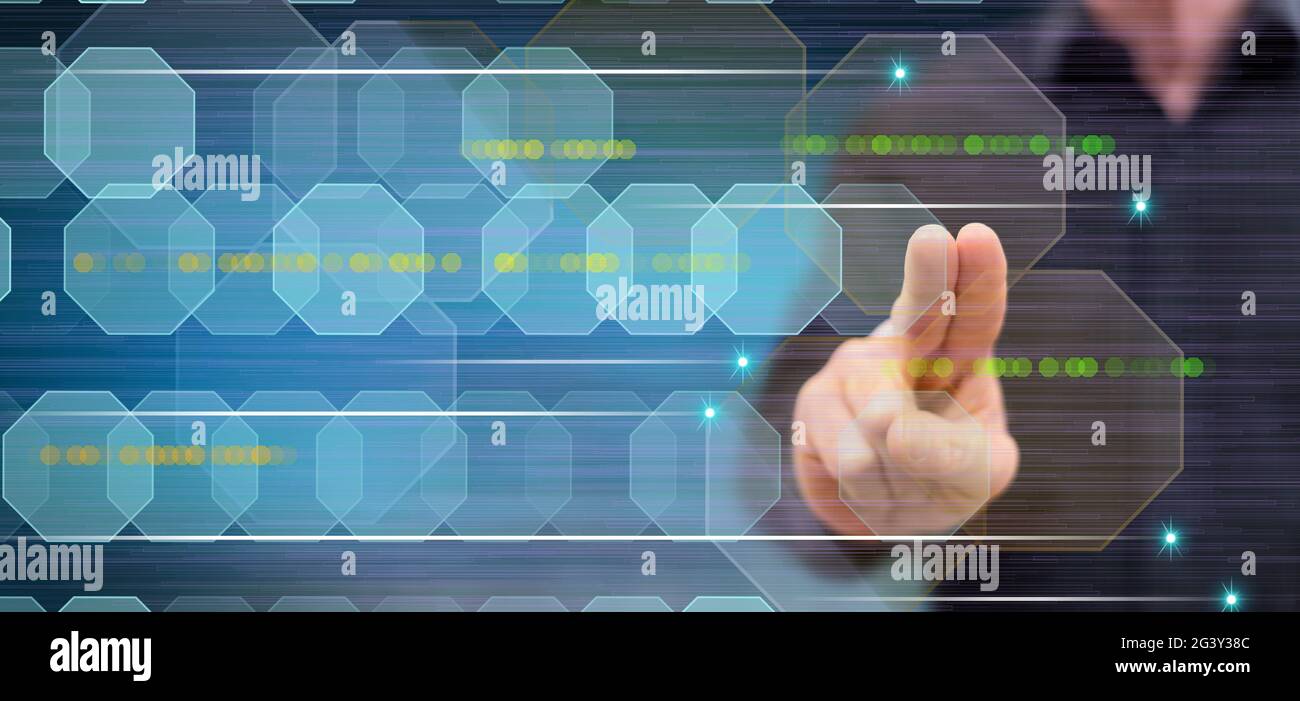Man touching an abstract technology concept on a touch screen with his ...
