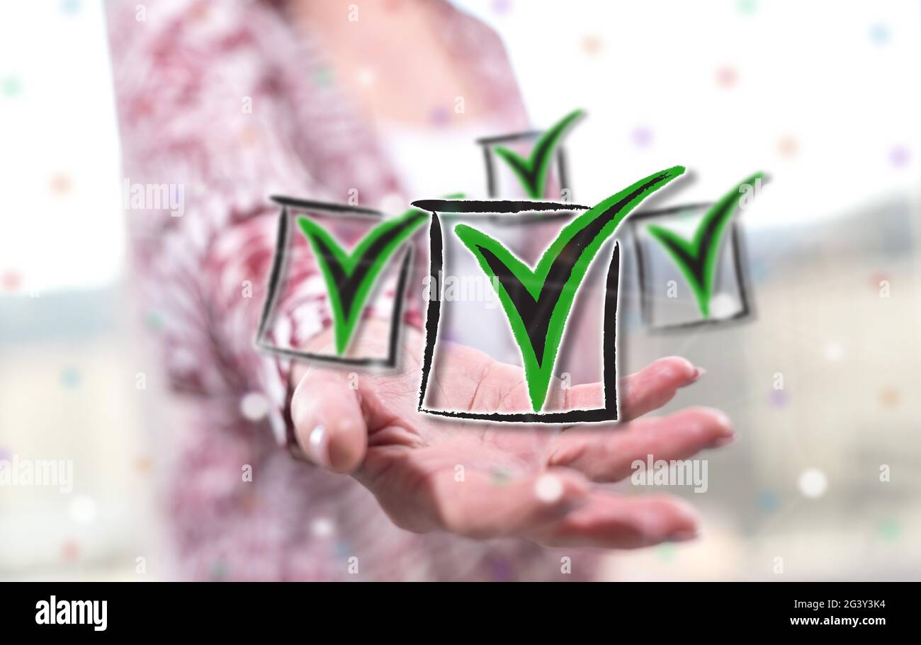 Validation concept above the hand of a woman in background Stock Photo ...