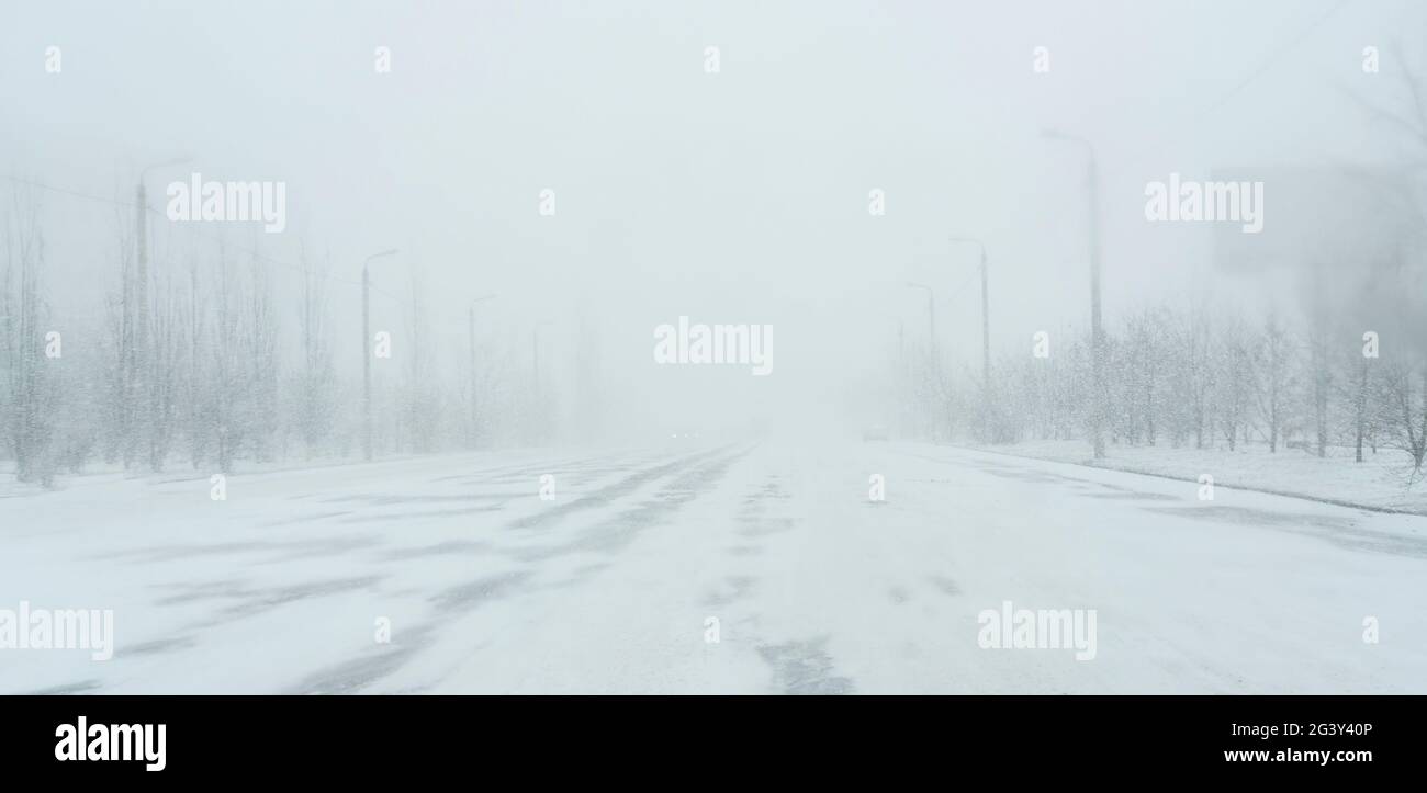 dangerous stormy weather in the city, collapse, snowfall on highway ...