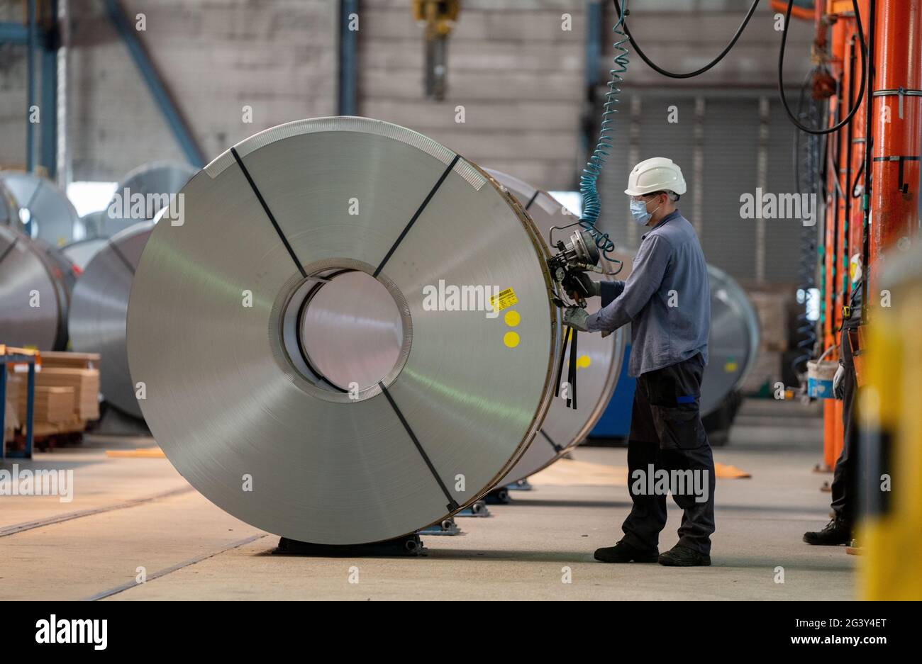 18 June 2021, Brandenburg, Eisenhüttenstadt: Galvanized and coiled ...