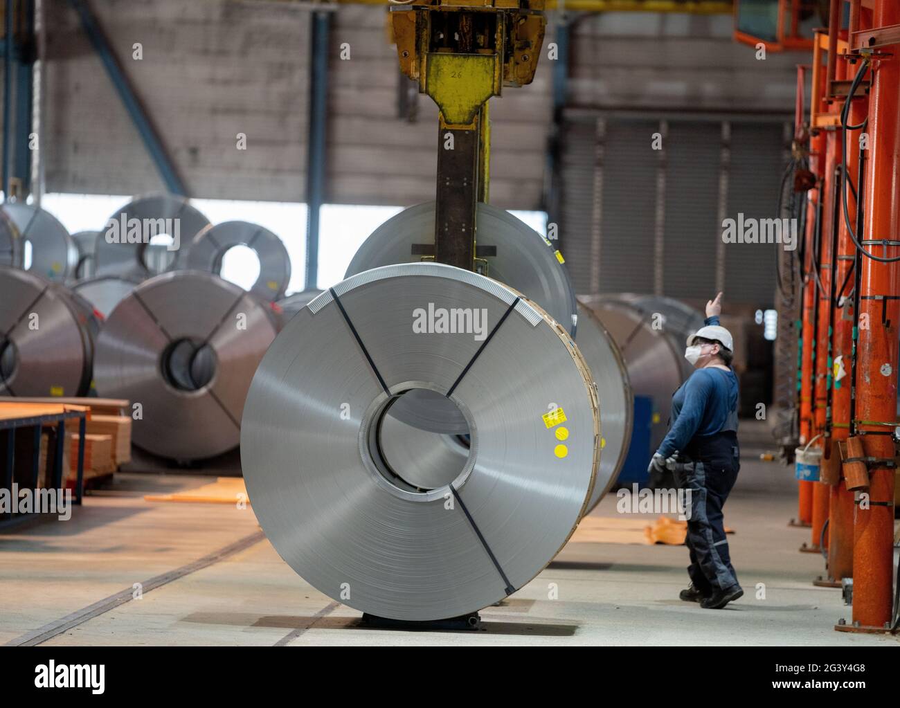 18 June 2021, Brandenburg, Eisenhüttenstadt: Galvanized and coiled ...
