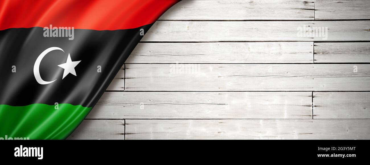 Libyan flag on old white wall banner Stock Photo - Alamy