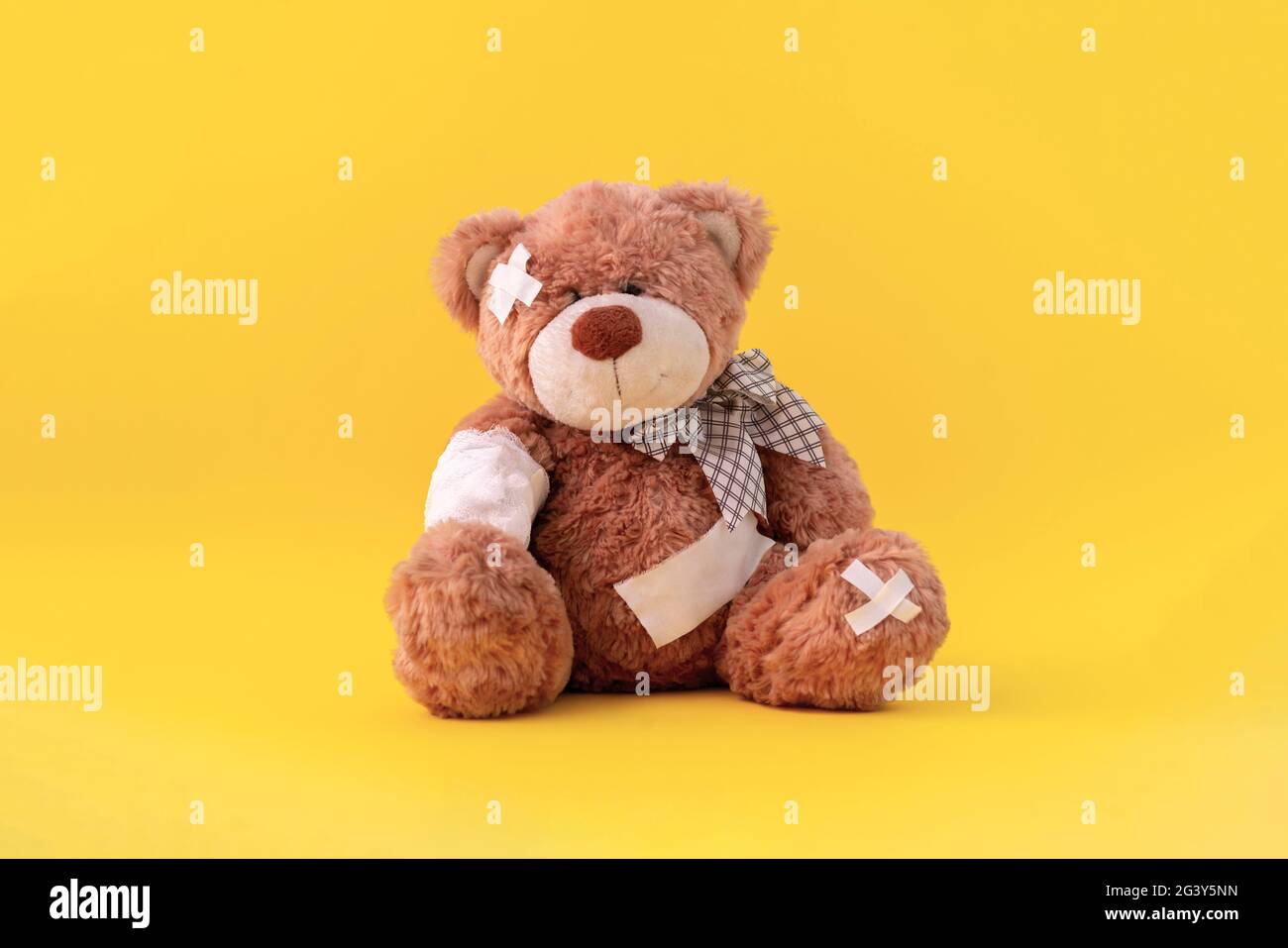 concept of pain and illness problem, teddy bear toy wrapped in bandage ...