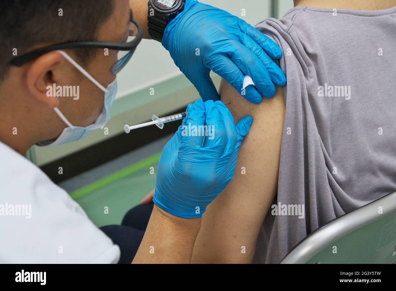 Tokyo, Japan. 18th June, 2021. A medical worker of Japan Self-Defense ...