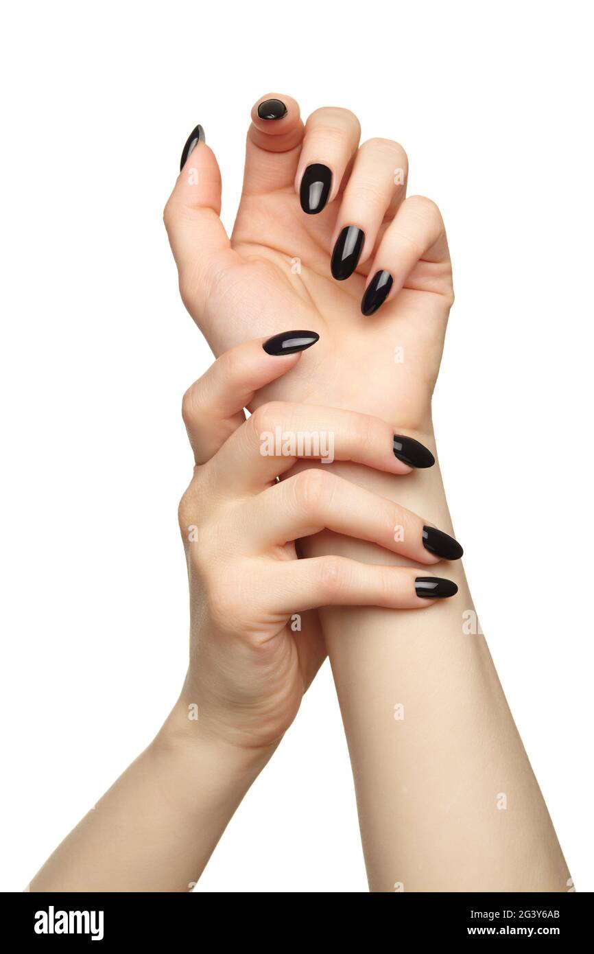 Female hands with black nails manicure isolated on white background ...
