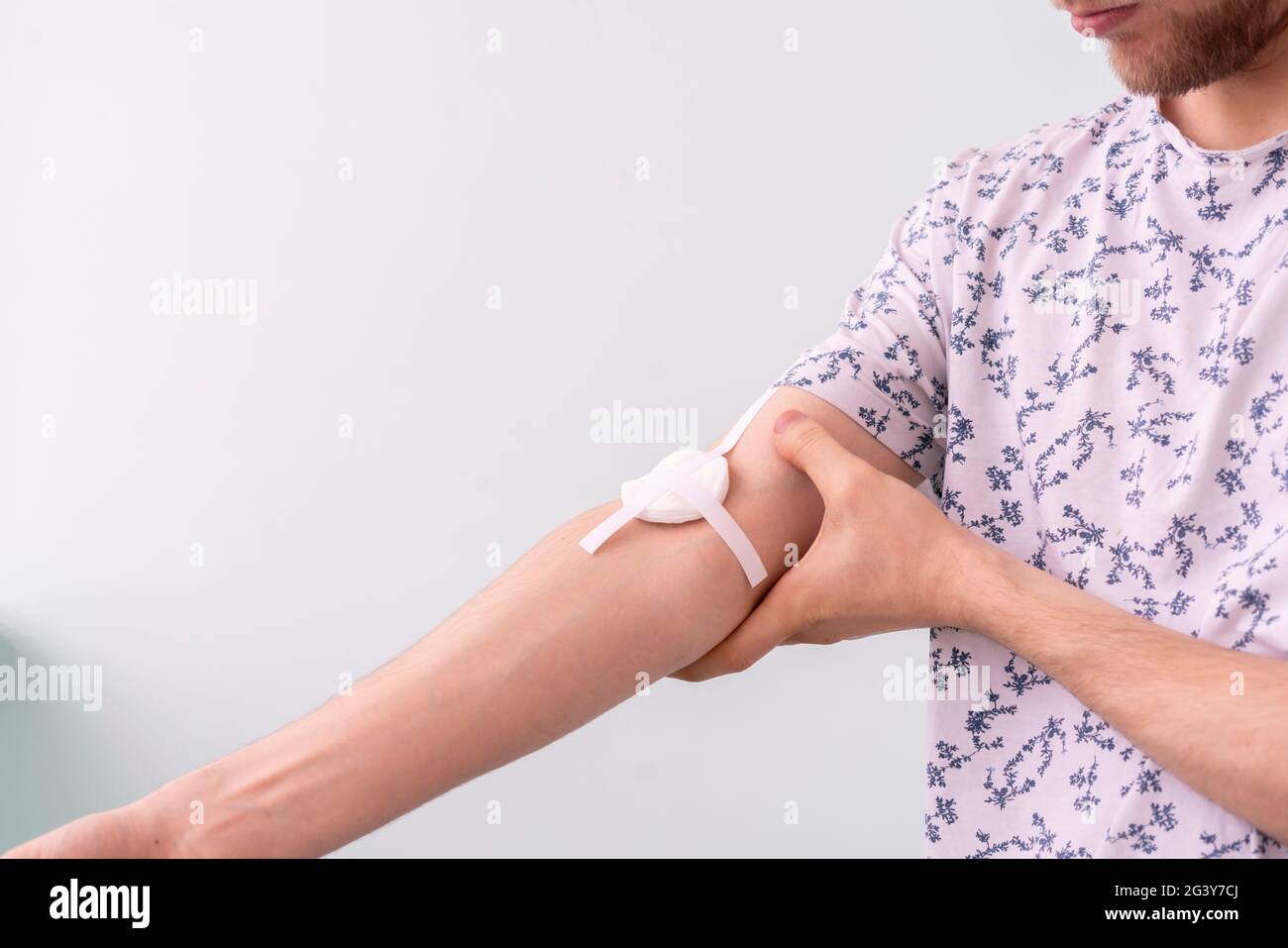 male hand bandage after the blood donation, medical patient donor ...
