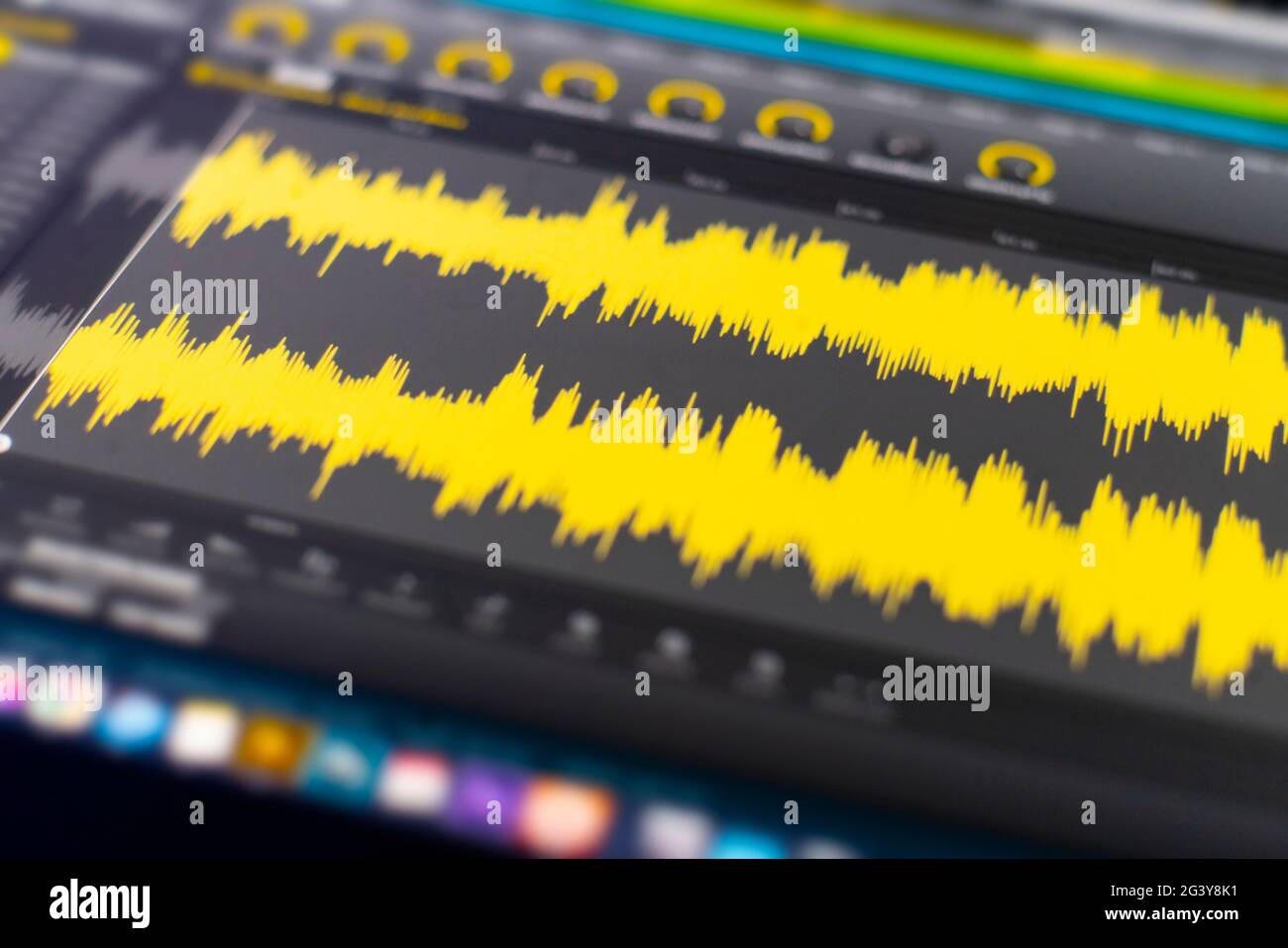 macro view of the computer monitor screen with sound audio wave graph ...