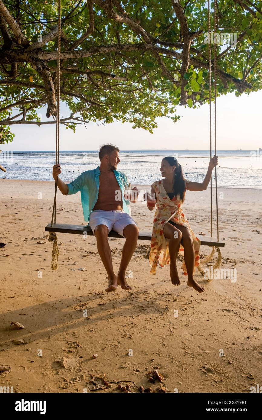 Romantic young couple on swing hi-res stock photography and images - Alamy