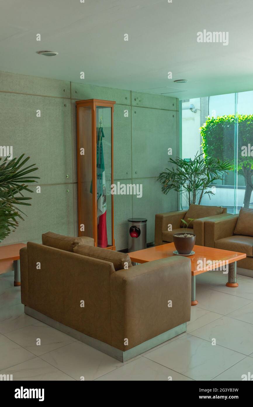 Vertical shot of comfortable coaches inside a waiting room of an office ...