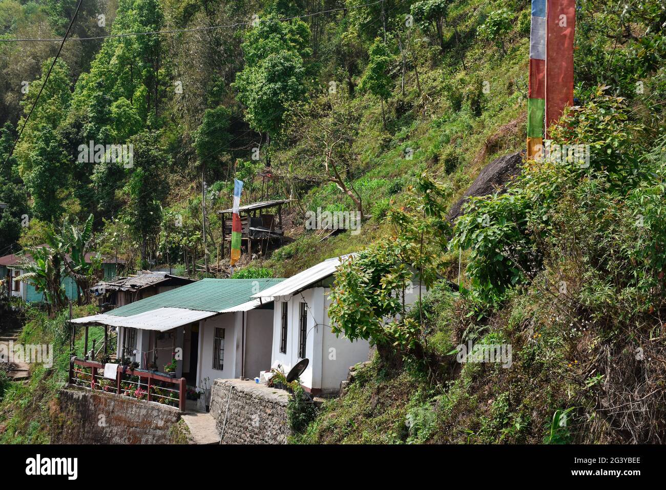 Traditional himalayan village, cottage , Buddhist prayer flags in ...