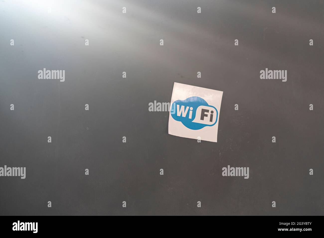 sign of wi-fi on the wall, abstract sticker attached in public place ...
