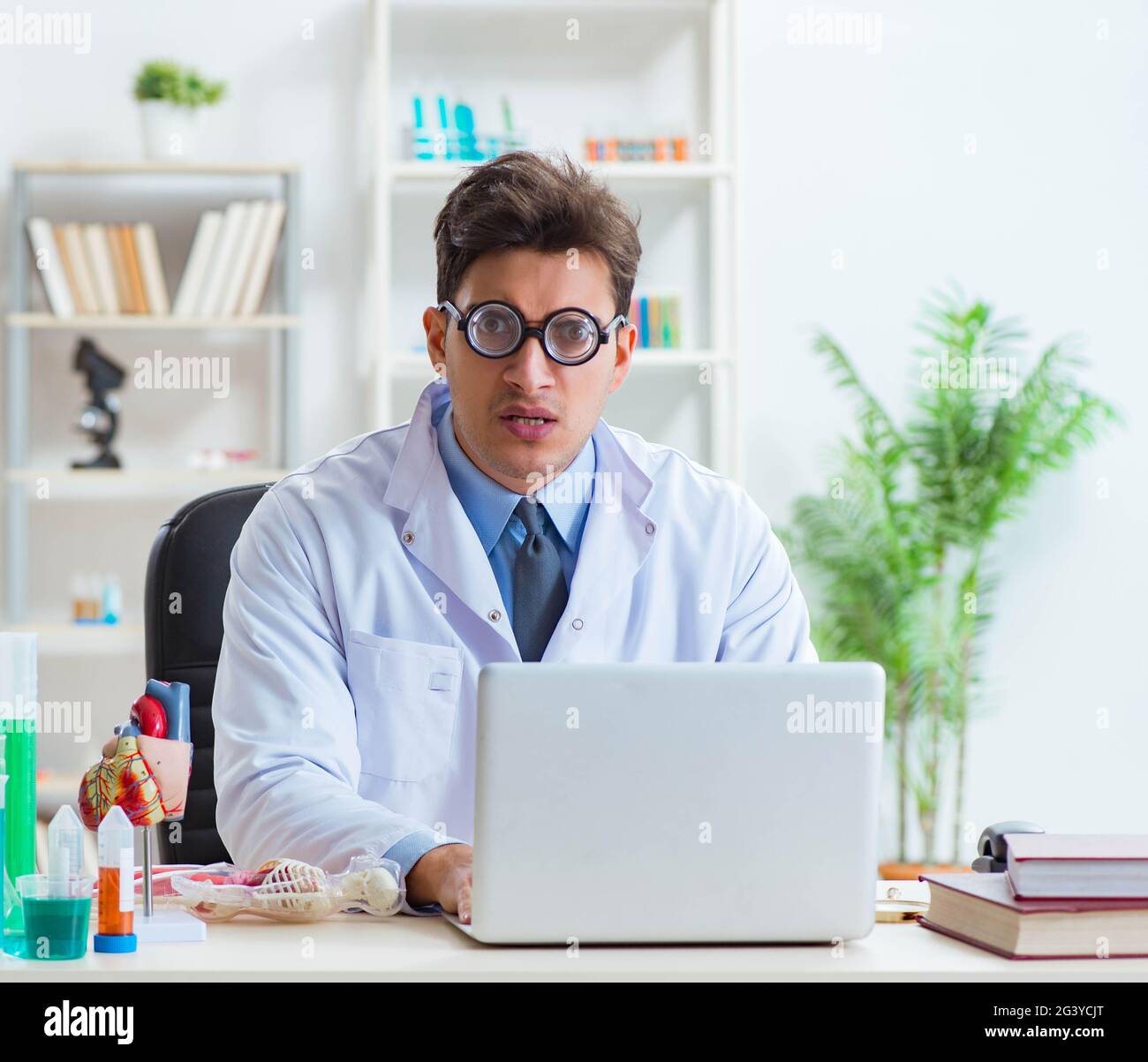 Funny doctor having fun in hospital lab Stock Photo - Alamy