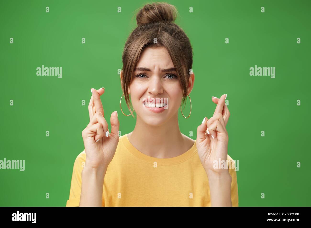 Close-up shot of nervous woman praying for having positive answer ...