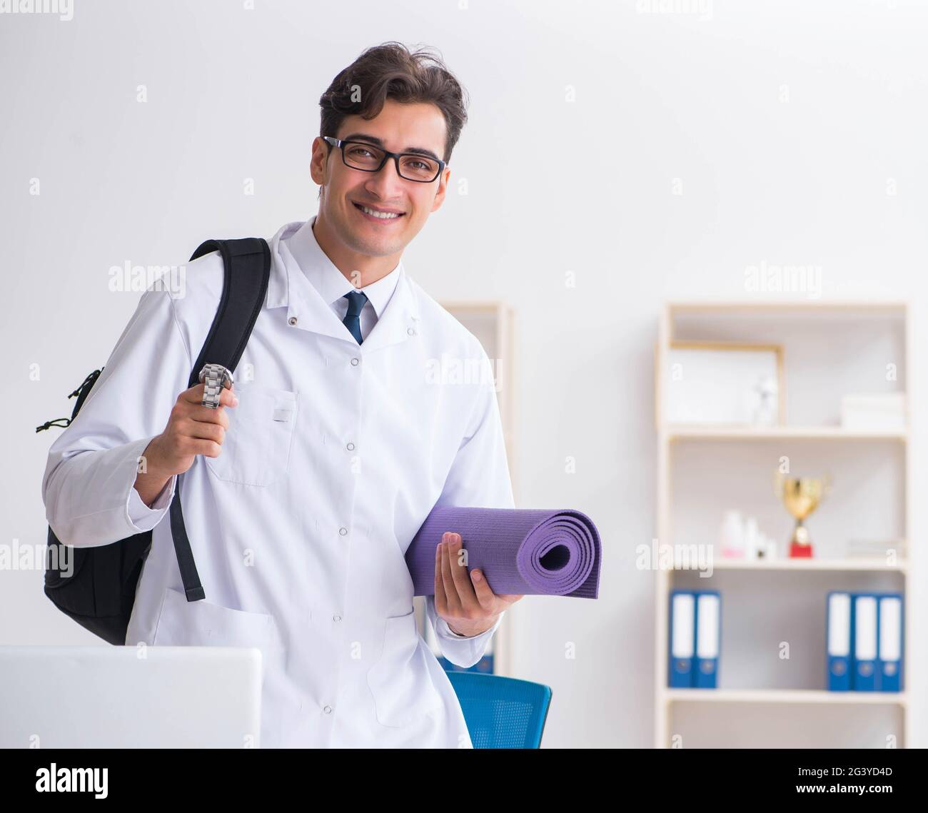 Doctor going to gym during lunch break Stock Photo - Alamy
