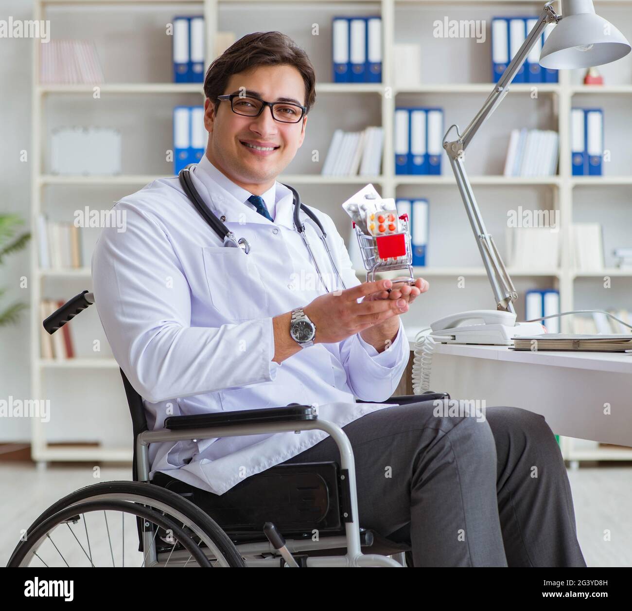 Disabled doctor on wheelchair working in hospital Stock Photo - Alamy