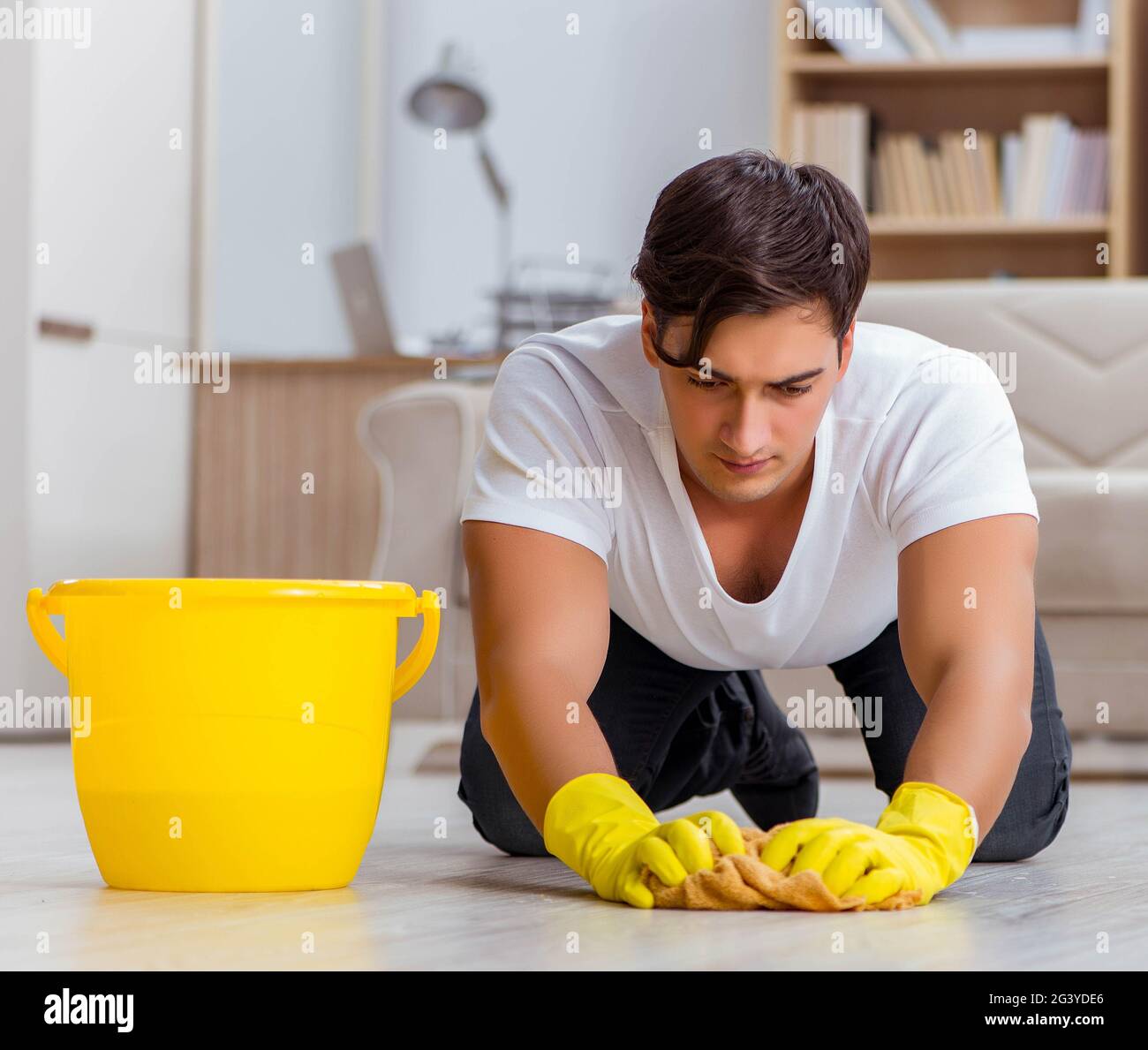 Man husband cleaning the house helping wife Stock Photo - Alamy