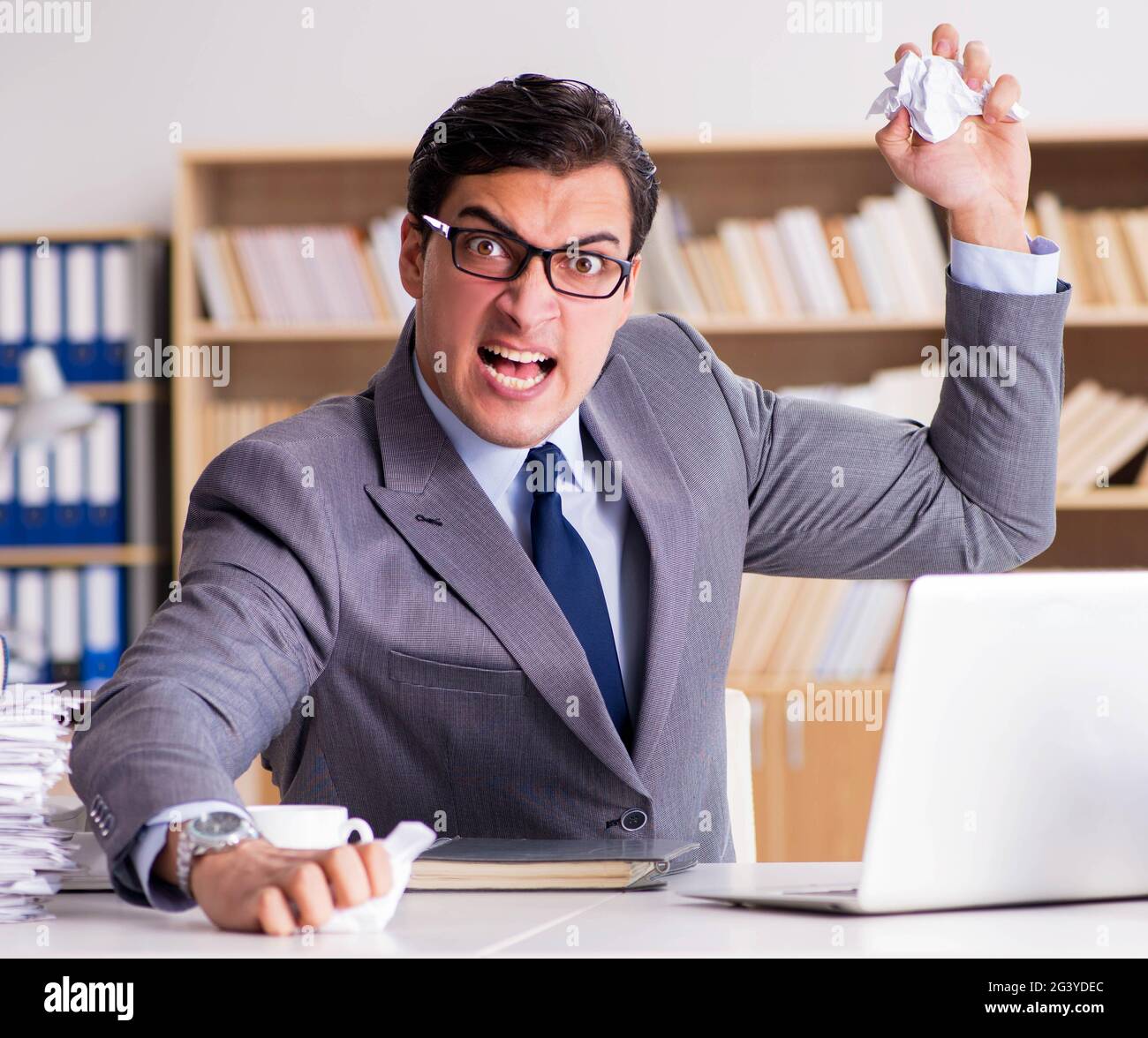 Angry businessman working in the office Stock Photo - Alamy