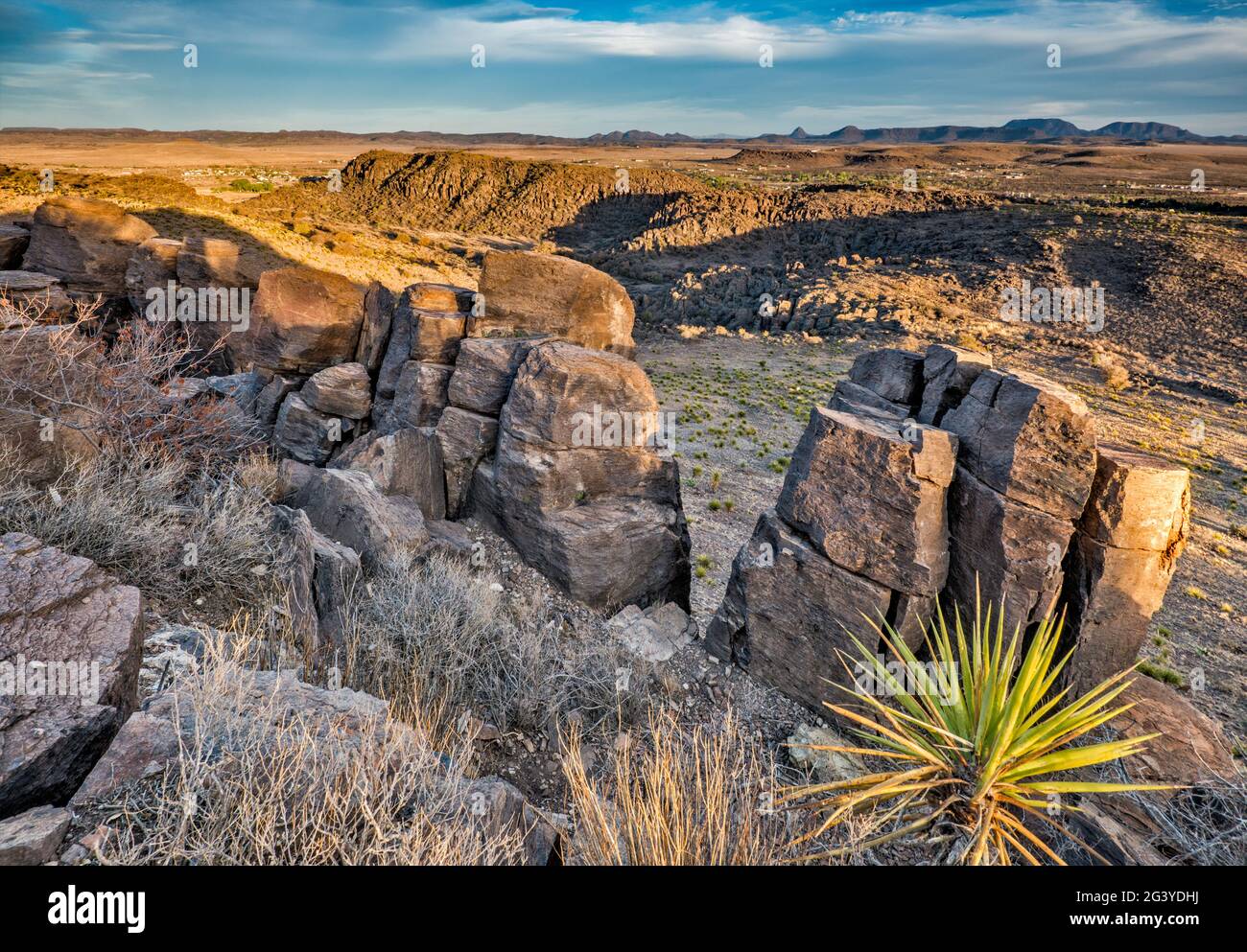 Boulders over ravine in foreground, distant mountains in Chihuahuan ...