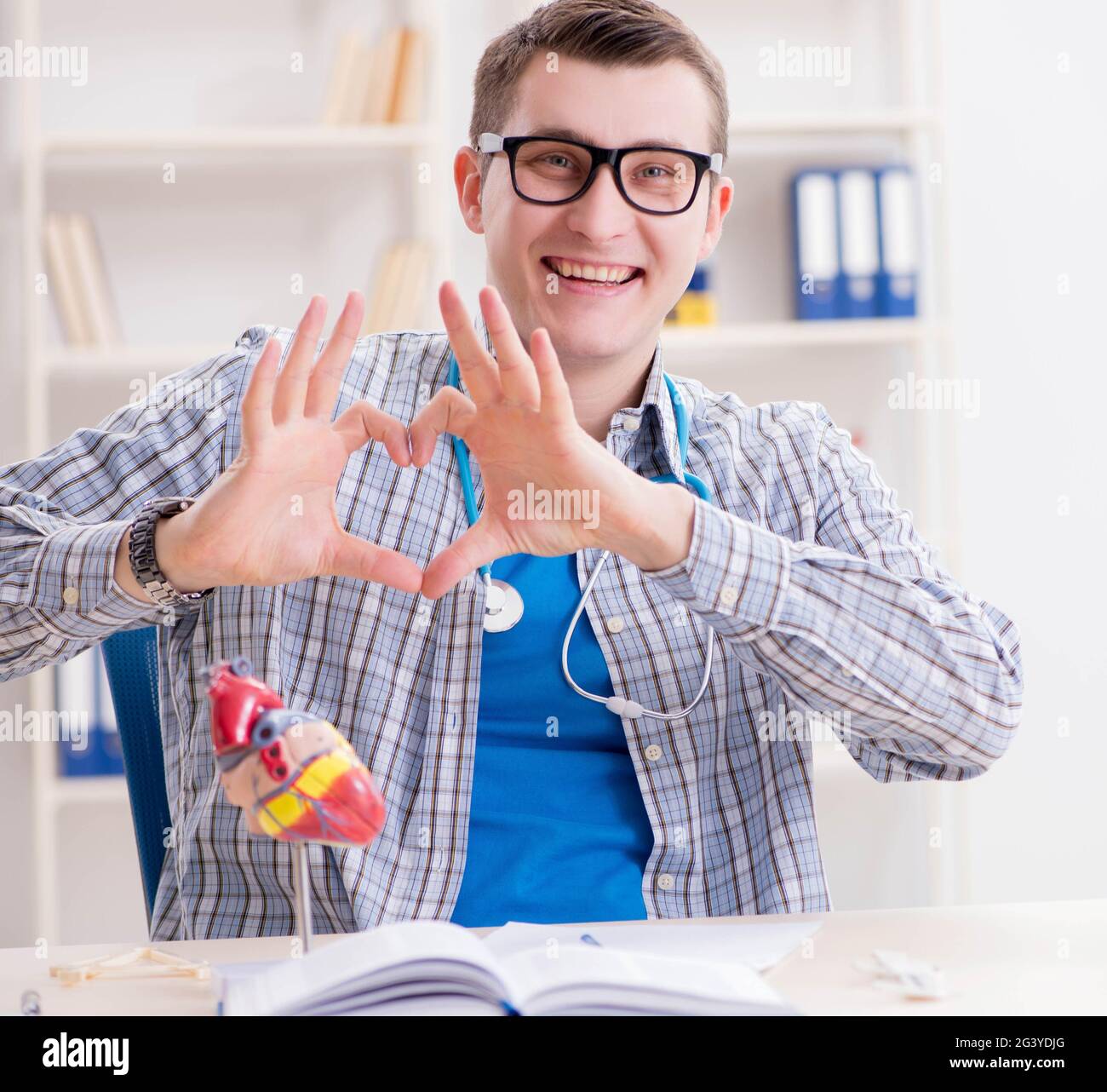 Medical student studying heart in classroom during lecture Stock Photo ...