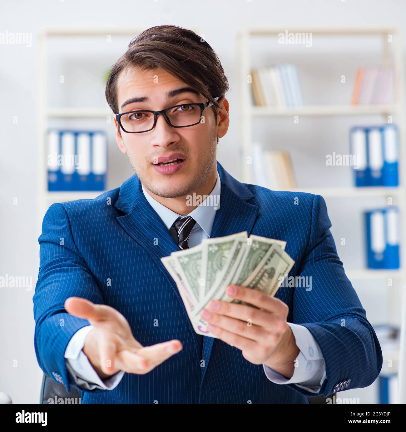 Businessman receiving his salary and bonus Stock Photo - Alamy