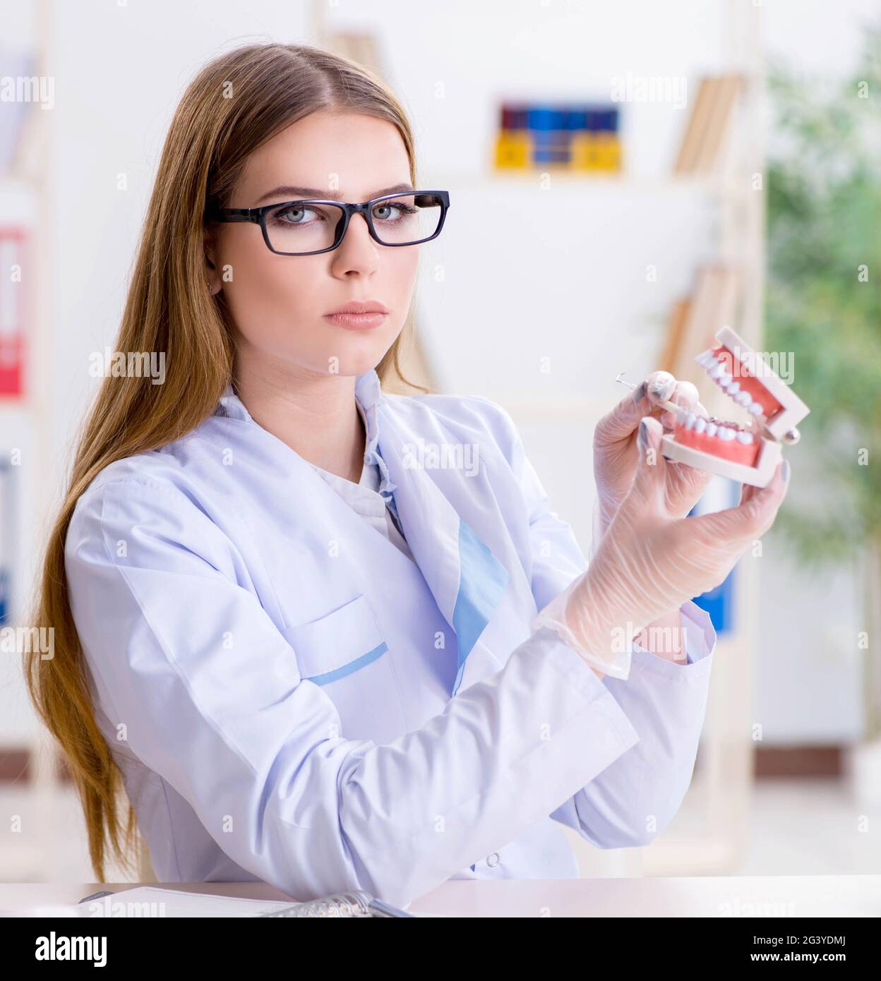 Dentistry student practicing skills in classroom Stock Photo - Alamy