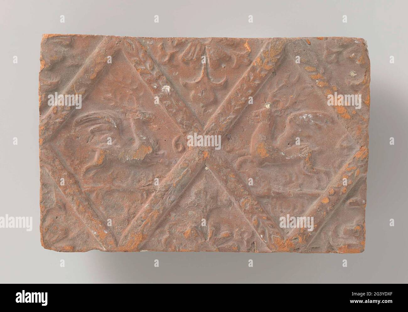 Fireplace with the year 1614 and two flying deer. Fireplace with the ...