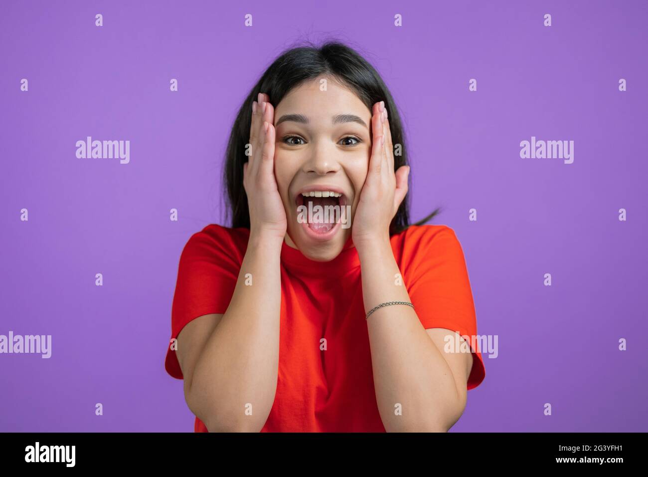 Asian woman is very glad, she screaming wow loud. Concept of sales ...