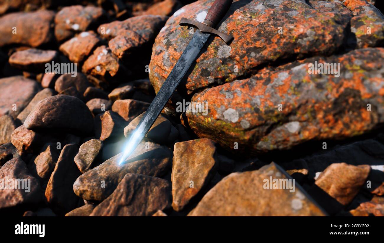 Old dagger on the rock at sunset Stock Photo - Alamy