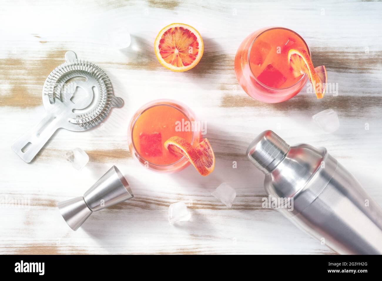 Cocktails, shot from above, toned image. Cocktail glasses, ice, shaker ...