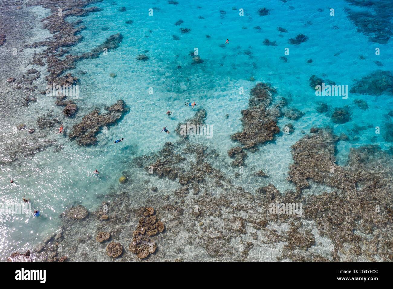 Aerial view of people snorkeling while snorkeling in the lagoon ...