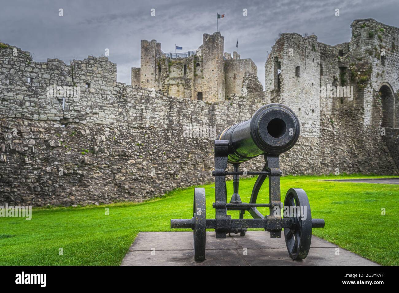 Old wheeled cannon or gun carriage and ruined Trim Castle from 12th ...