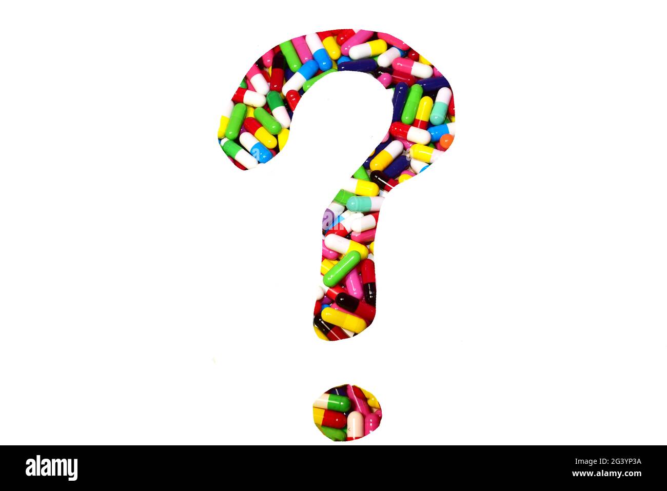 Pills in capsules in the form of a question mark on a white background ...