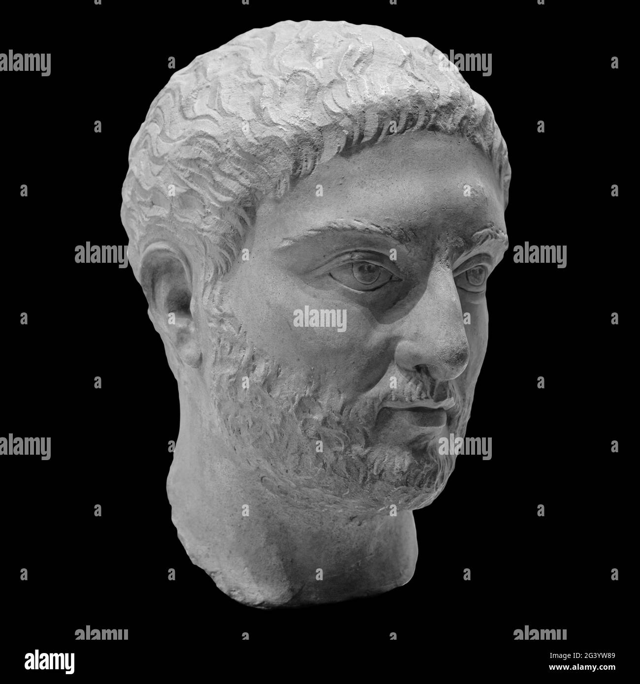 Head detail of the ancient man sculpture. Stone face isolated on black ...