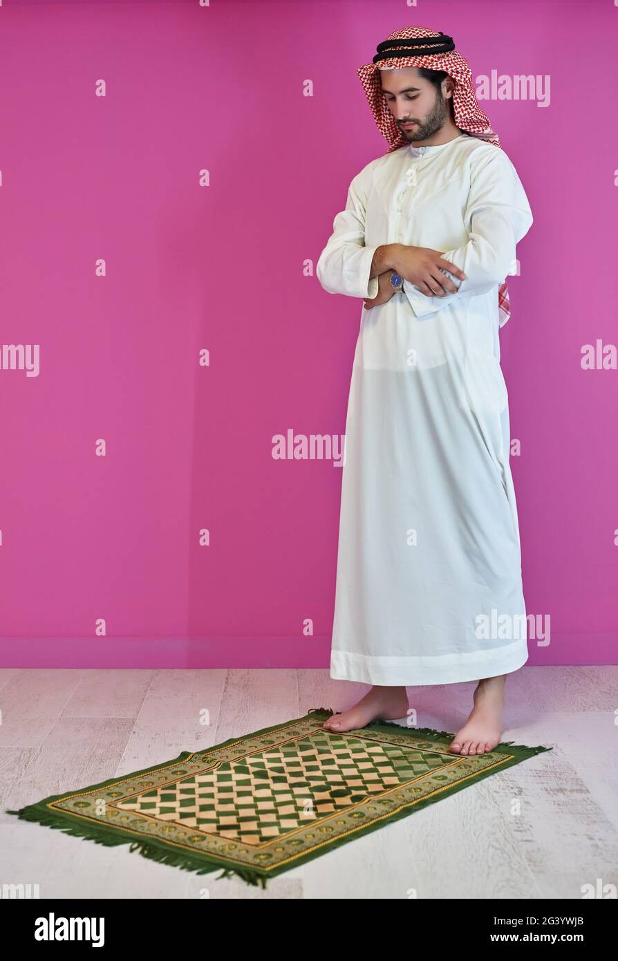 Young muslim man praying salat during Ramadan Stock Photo - Alamy