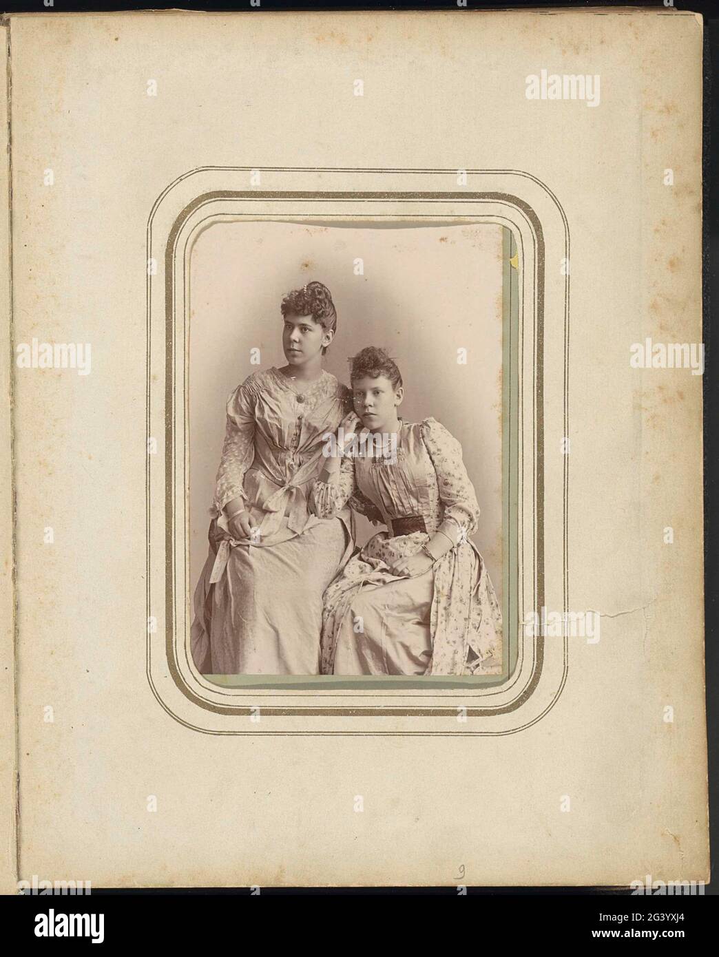 Portrait of two women in dresses. Part of family album from H.W.F ...