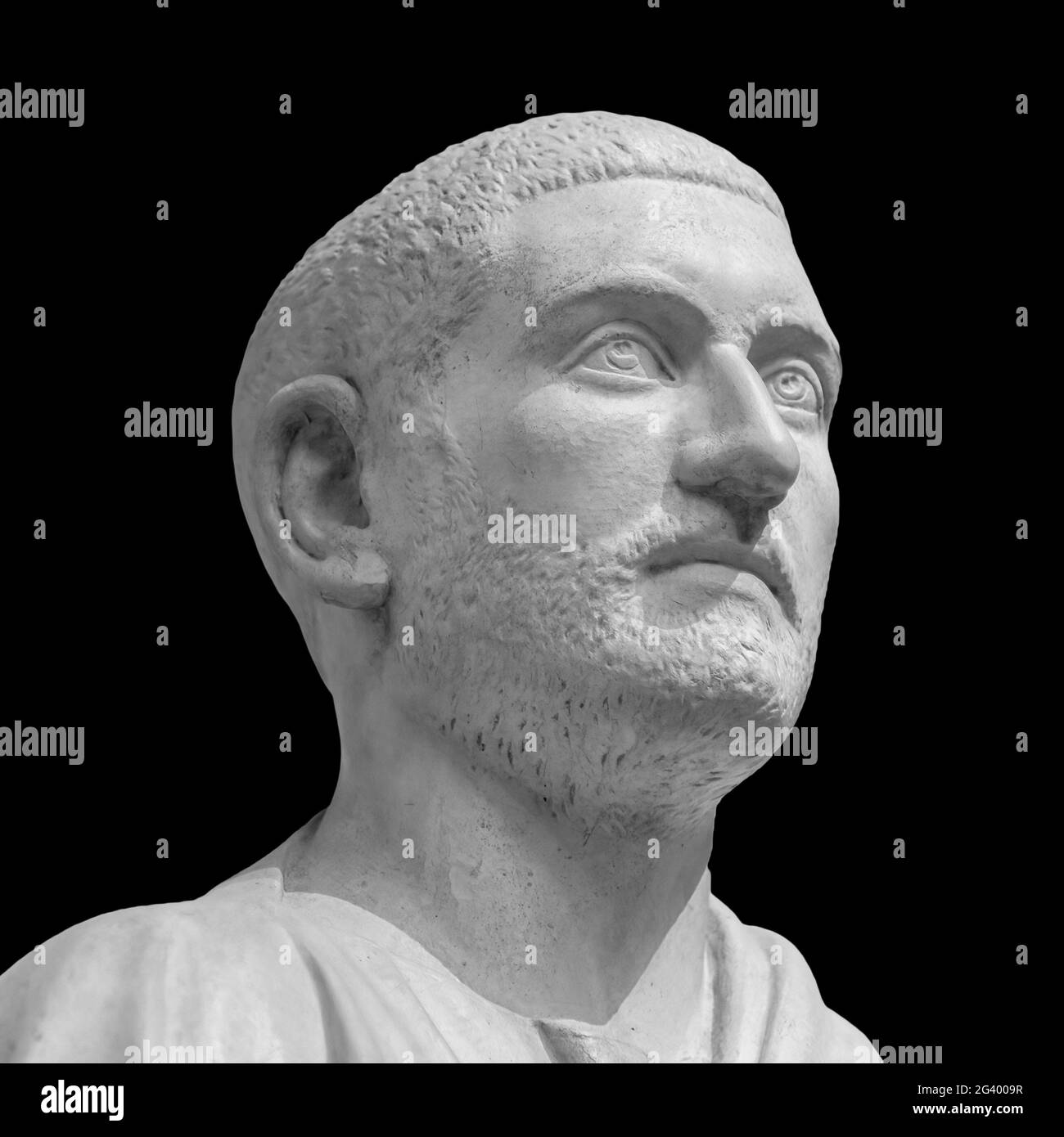 Head detail of the ancient man sculpture. Stone face isolated on black ...