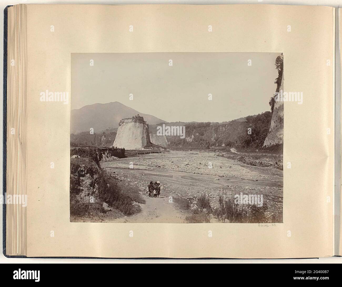 Indian women and children at a riverbed dry in a worn out landscape ...