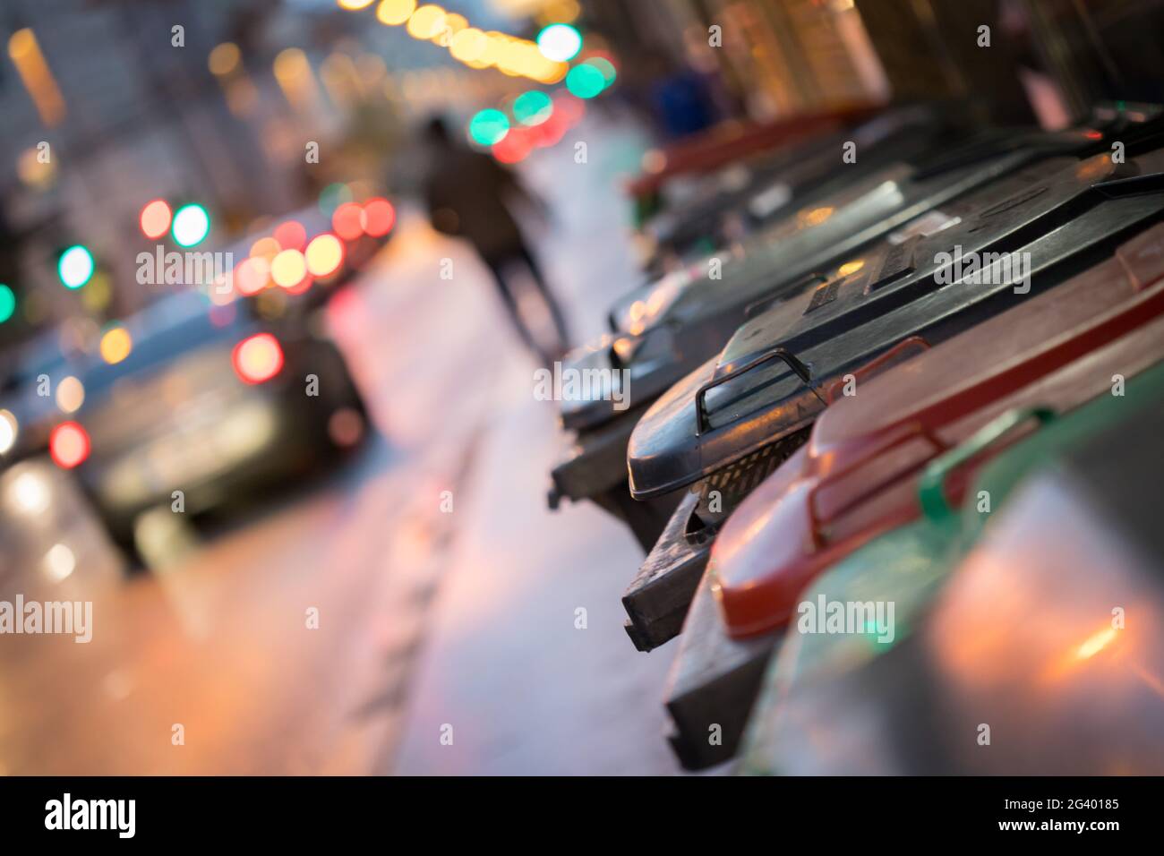 Garbage cans and street lights in urban city, evening Stock Photo - Alamy