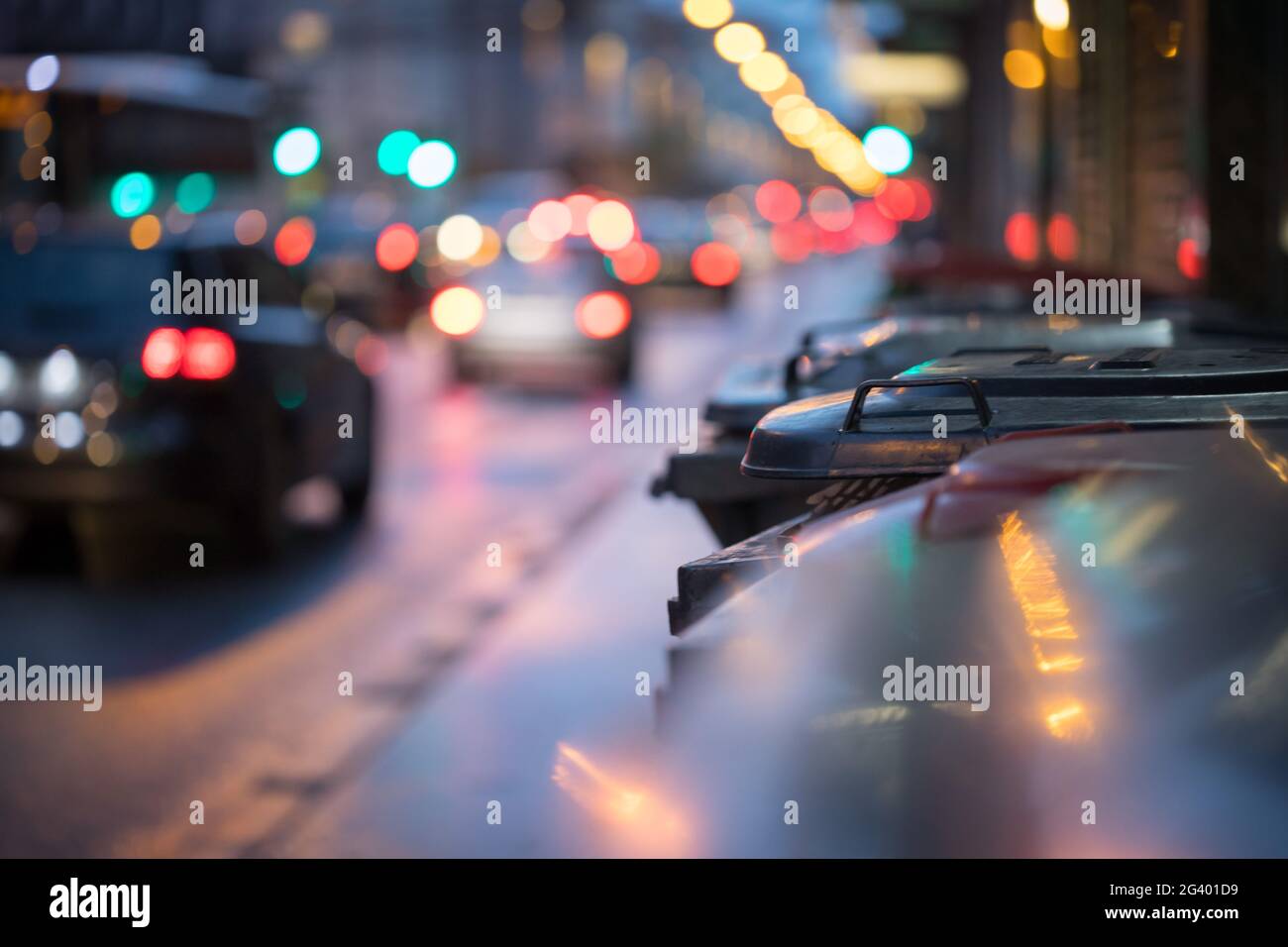 Garbage cans and street lights in urban city, evening Stock Photo - Alamy