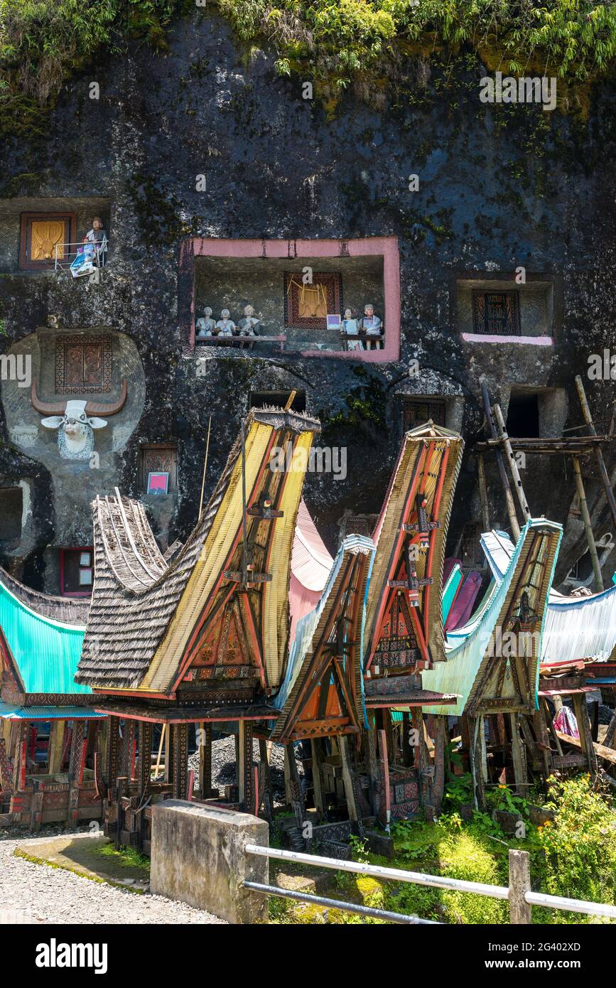 Houses of the dead in front of the Loâ€™ko Mata rock in Tana Toraja ...