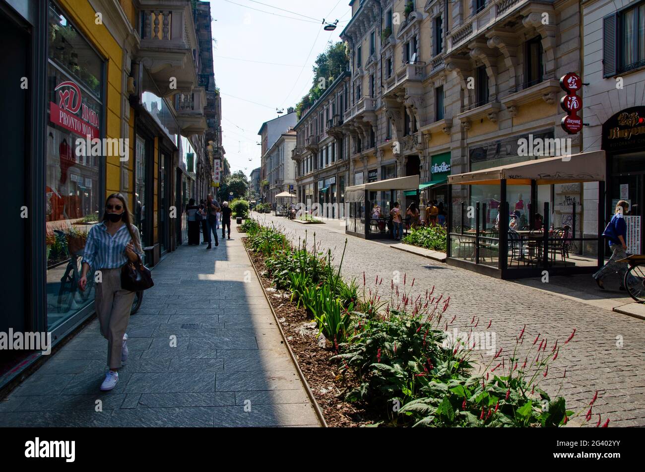 Strolling in the pedestrian street in the heart of Chinatown in Milan ...