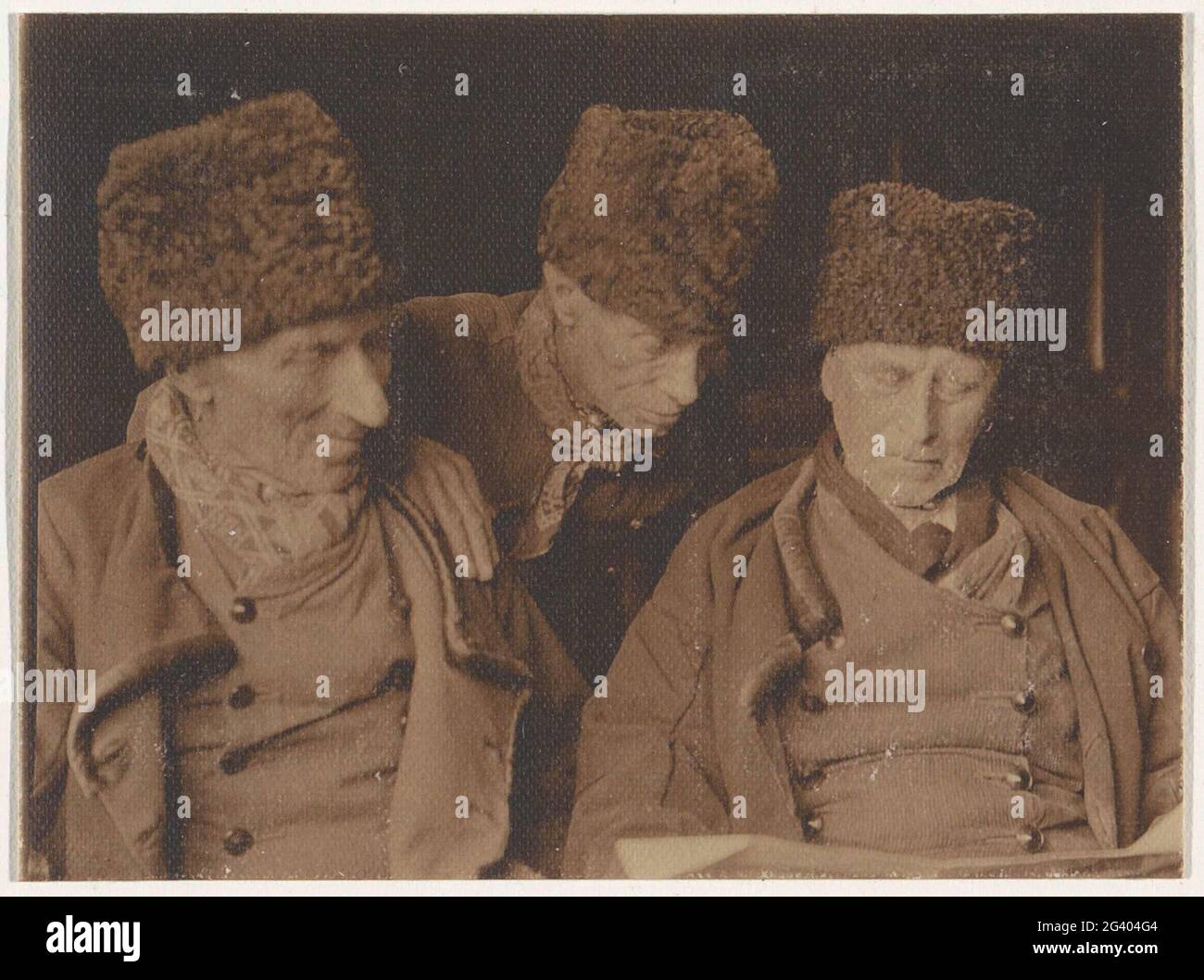 Portrait of three men in Volendam traditional costume, sitting and ...