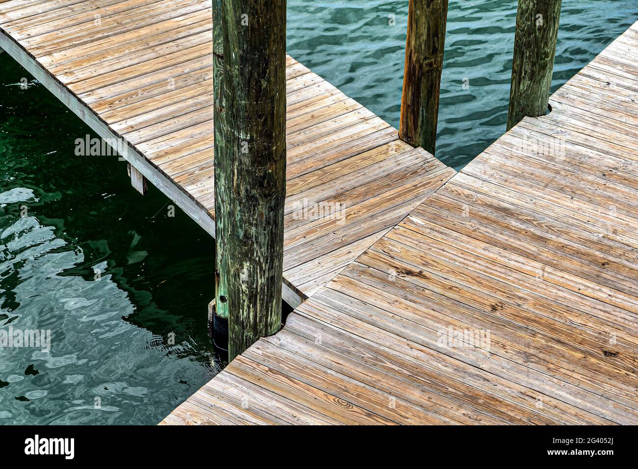 Wooden pilings on a dock in the river Stock Photo - Alamy