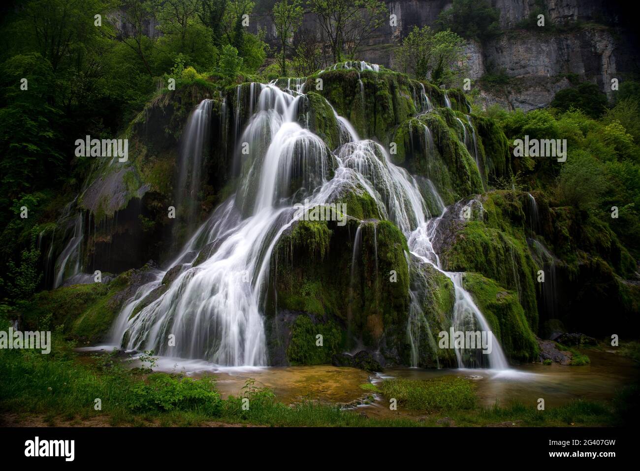 Natural view of a beautiful waterfall flowing downstream from the top ...