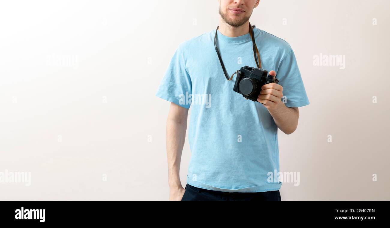 happy person holding a vintage old camera and making photos Stock Photo ...