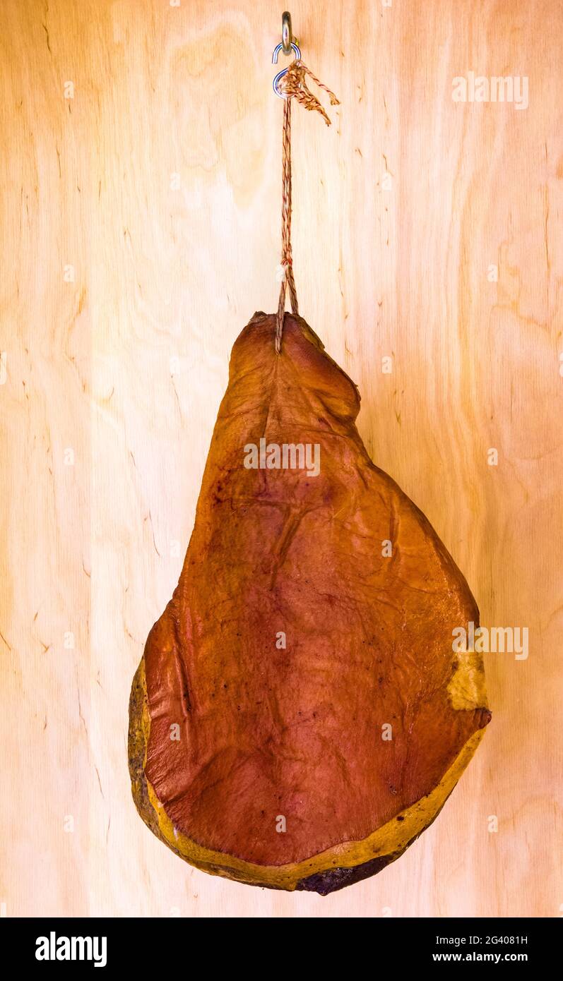 Hanging smoke ham Stock Photo - Alamy