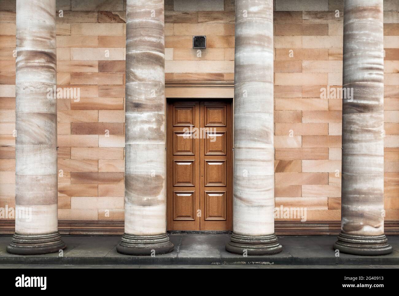 Columns and facade with door Stock Photo - Alamy