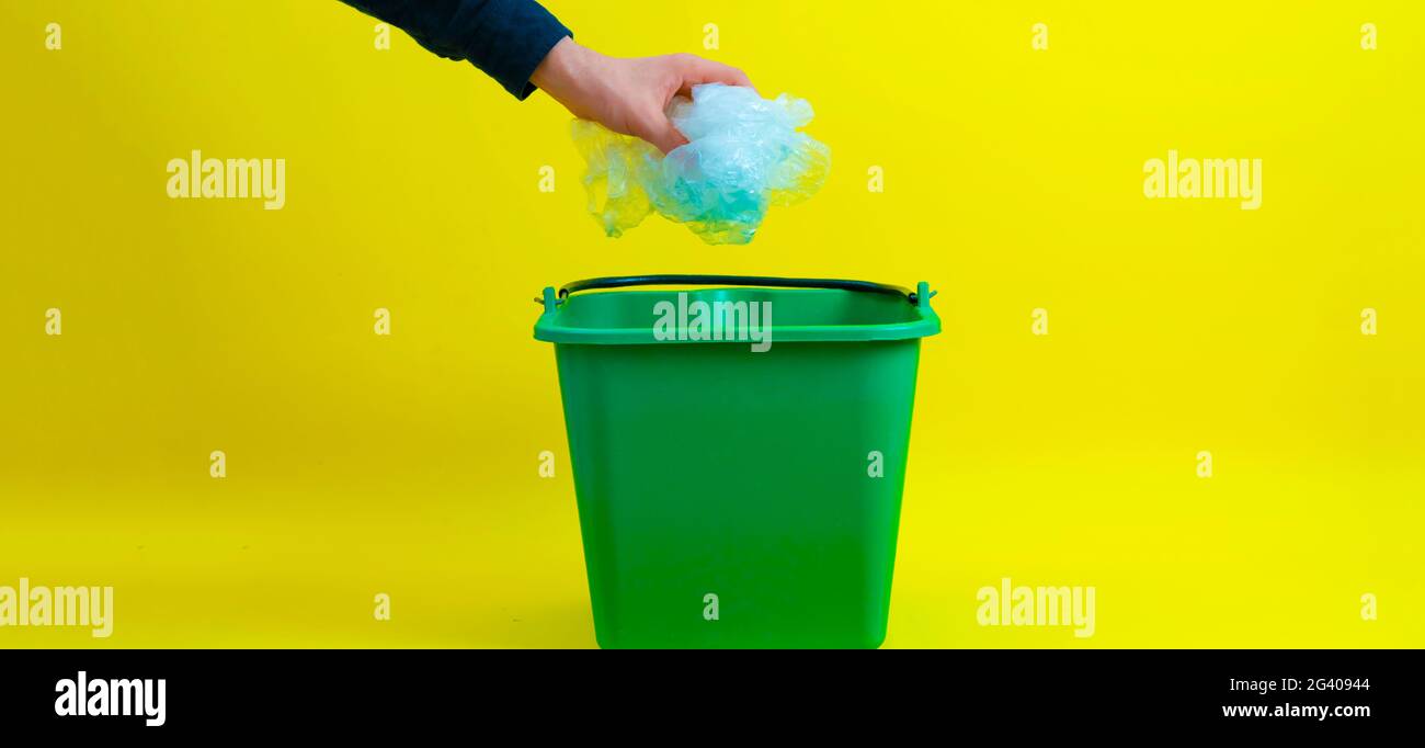 person hand drop trash in the garbage bin Stock Photo - Alamy