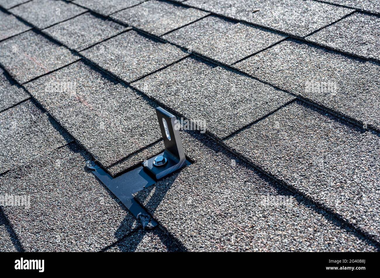 Residential asphalt shingle roof with metal anchors installed for the ...
